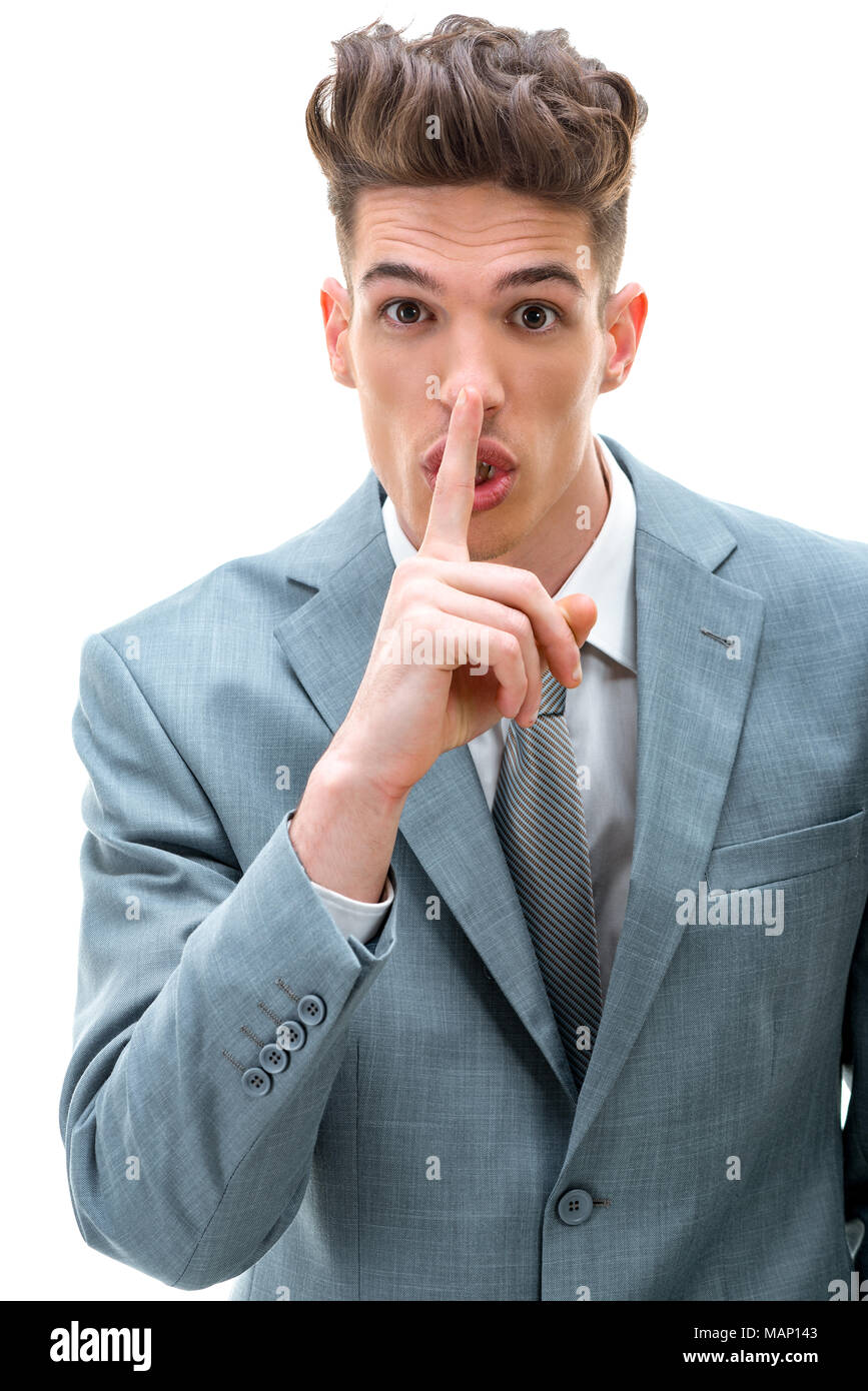 Young man asking to keep business plan in secret, making hush hand ...