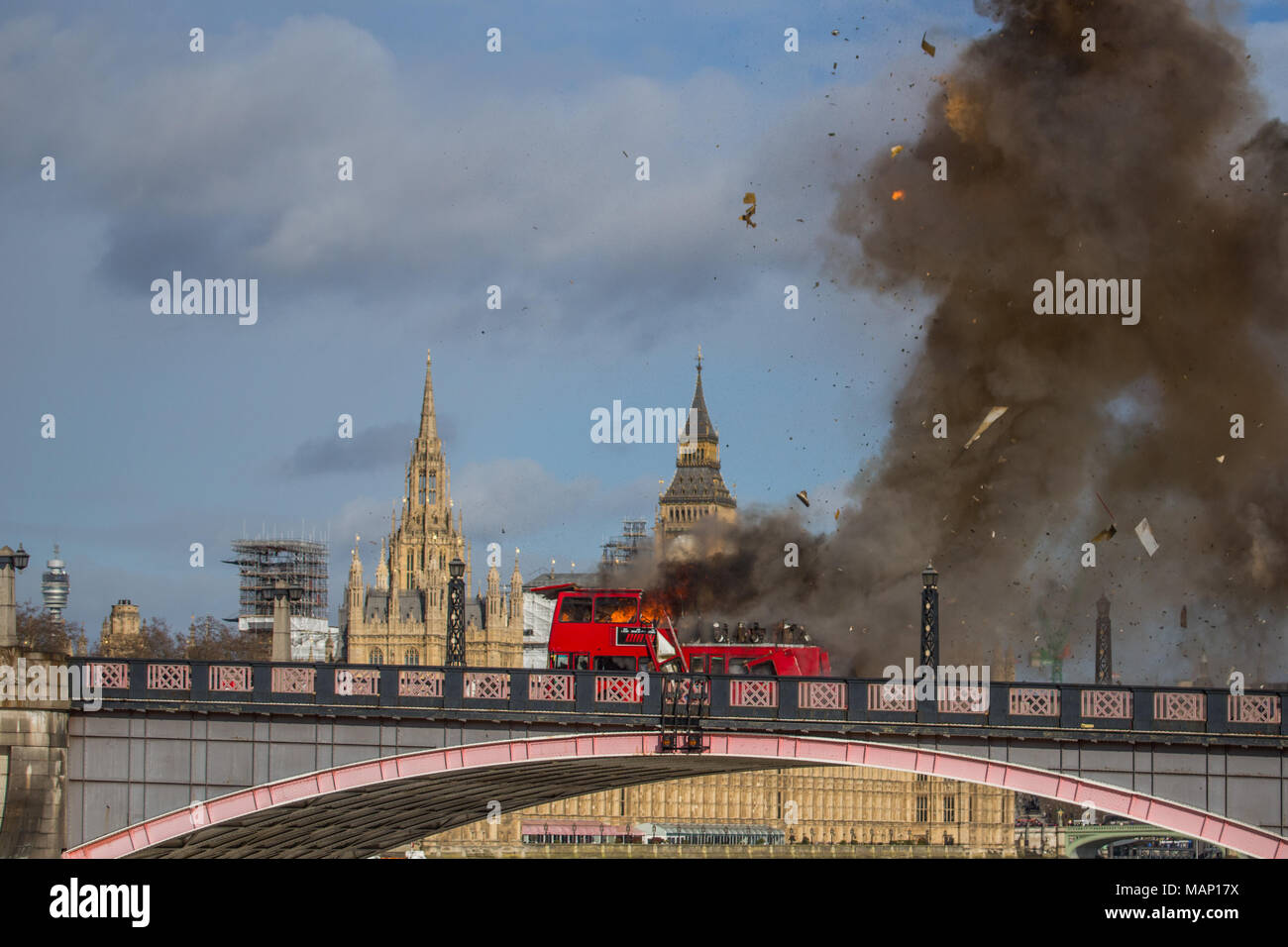 A bus explodes on Vauxhall bridge for the filming of a uk TV show Stock ...