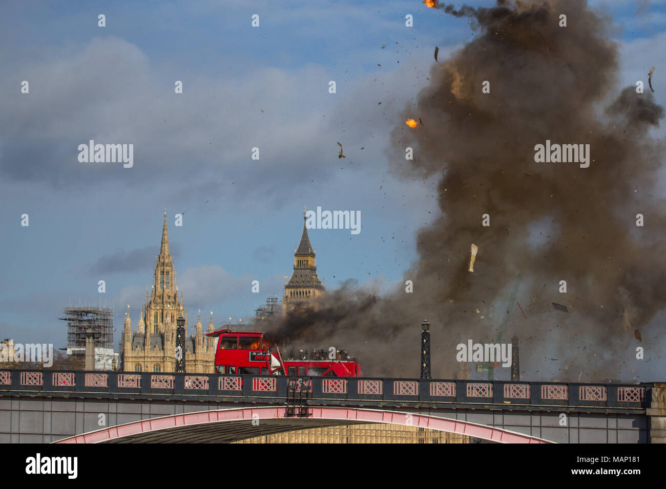 A bus explodes on Vauxhall bridge for the filming of a uk TV show Stock ...