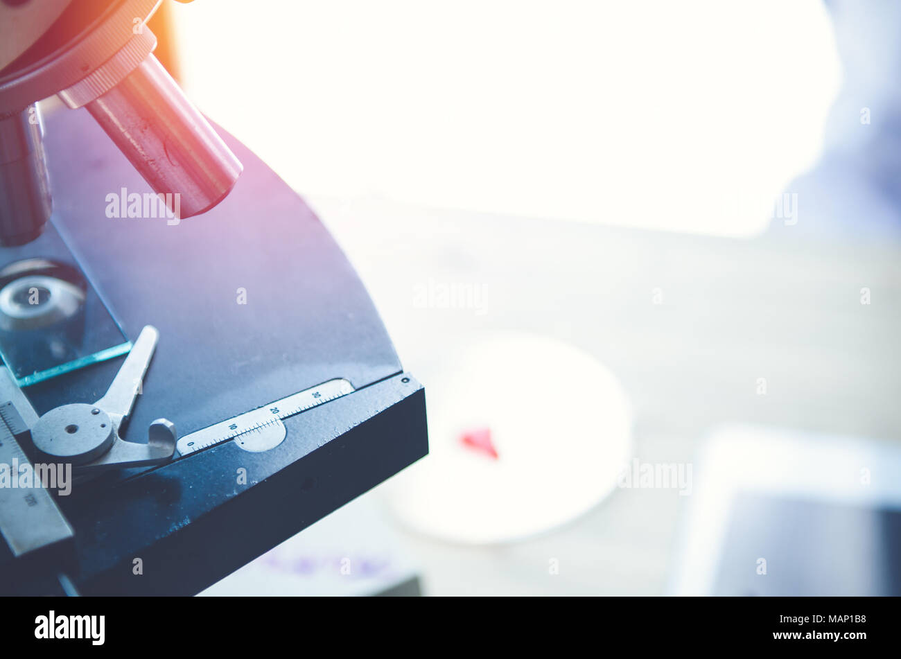 Close-up shot of microscope with metal lens at laboratory. Scientific ...