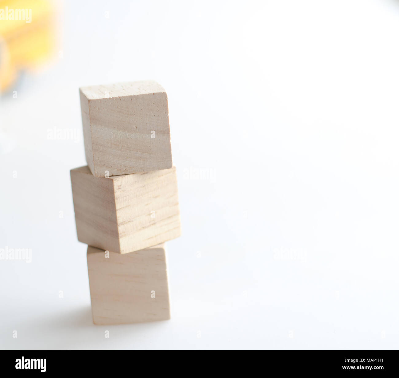 brown wood bricks tower on white background Stock Photo - Alamy