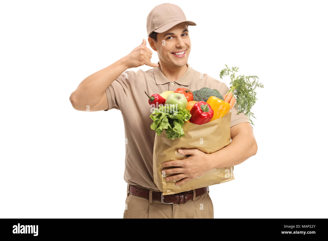 Delivery man with a bag of groceries making a call me gesture isolated ...