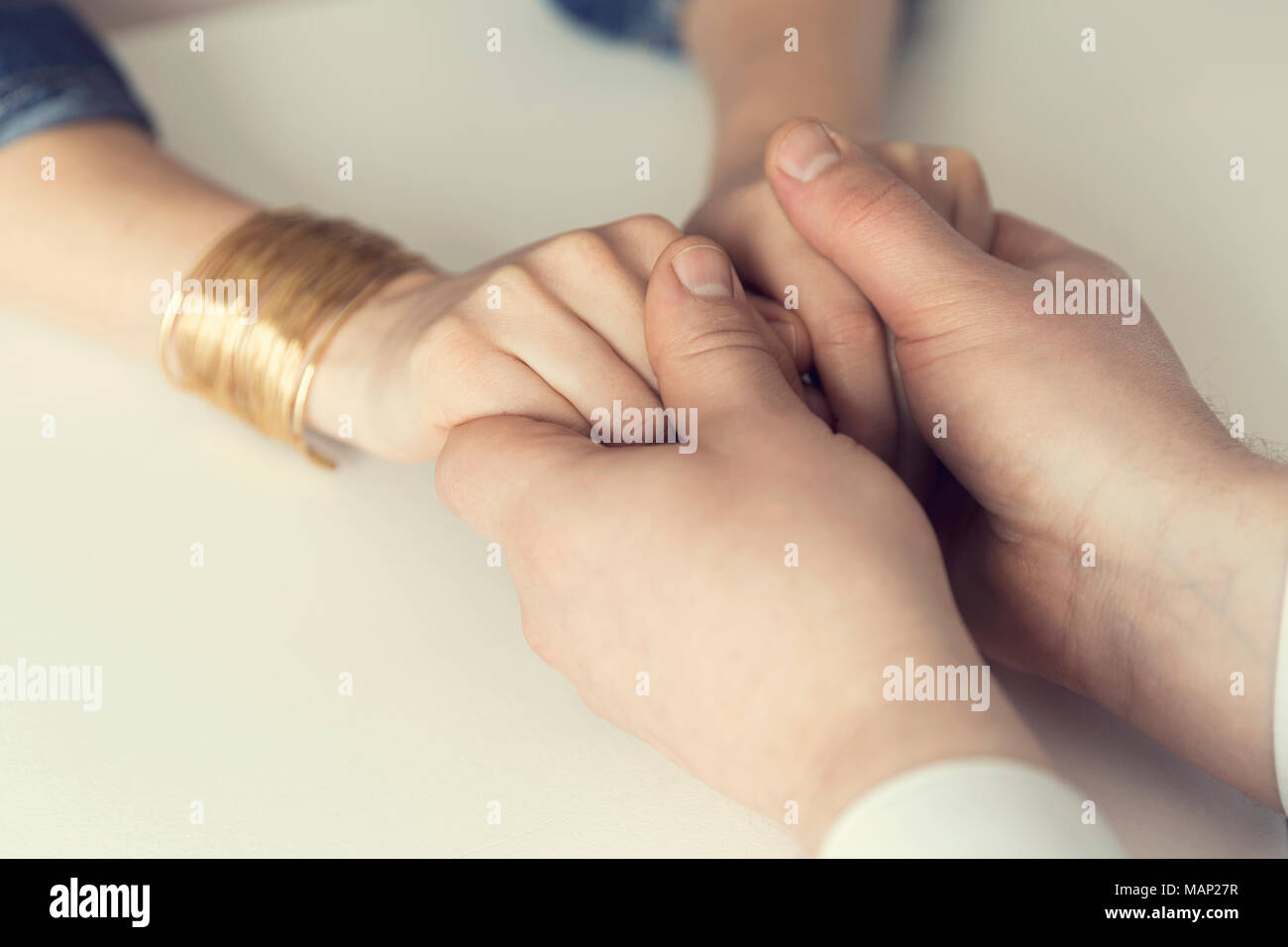 Husband holding hands of his wife. Mental support, marriage, couples ...