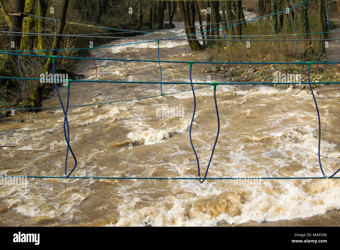 Rope bridge over the fast river, training for survival skills Stock ...