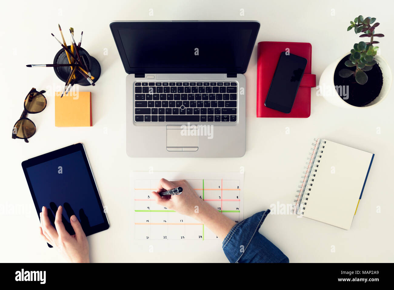 Calendar planner agenda schedule concept. Woman working in her office ...