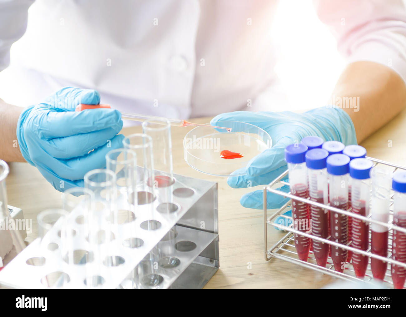 Test tubes blood in beaker hi-res stock photography and images - Alamy