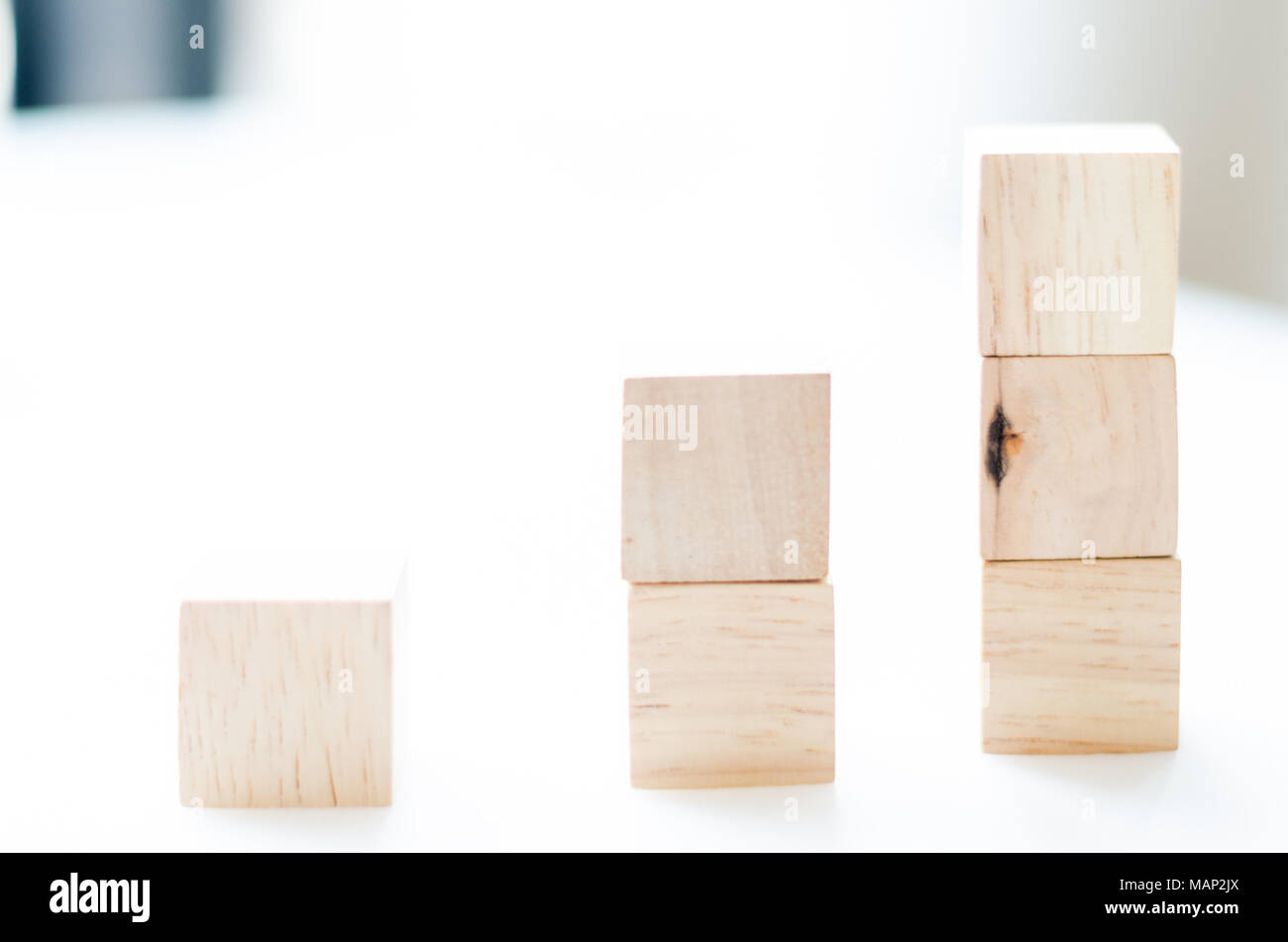 brown wood bricks tower on white background Stock Photo - Alamy