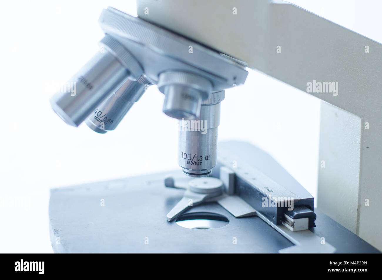 Close-up shot of microscope with metal lens at laboratory. Scientific ...