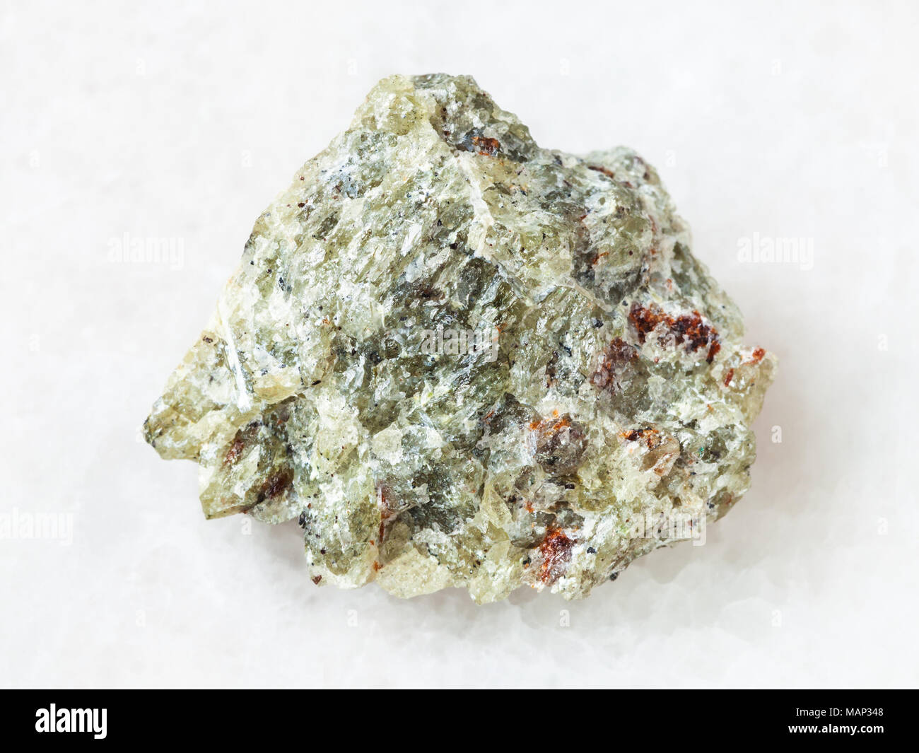 macro shooting of natural mineral rock specimen - raw olivine stone on ...