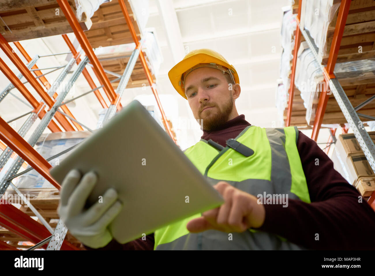 Worker Doing Inventory in Warehouse Stock Photo - Alamy