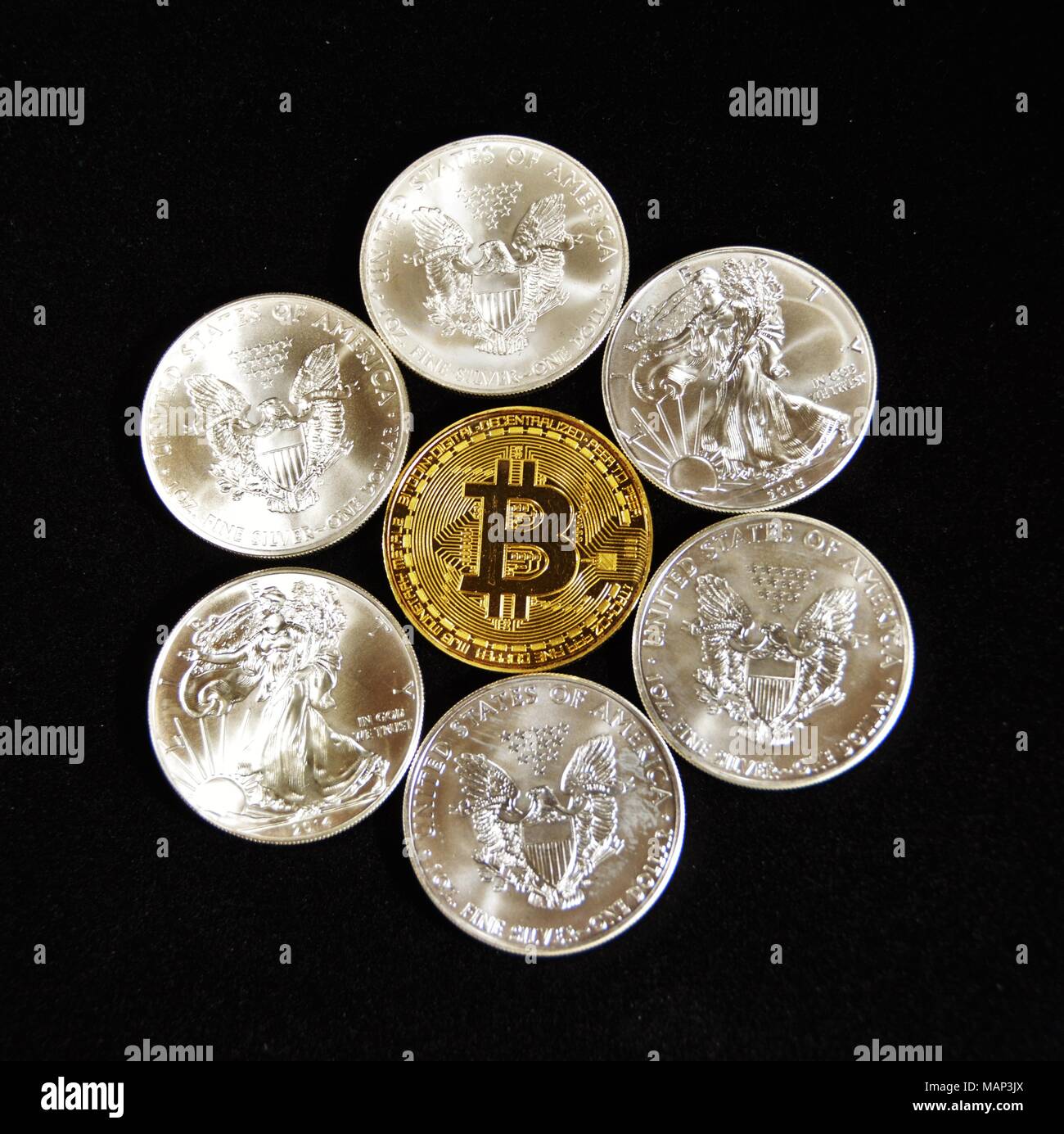 Bit coins with silver dollars and diamonds Stock Photo - Alamy