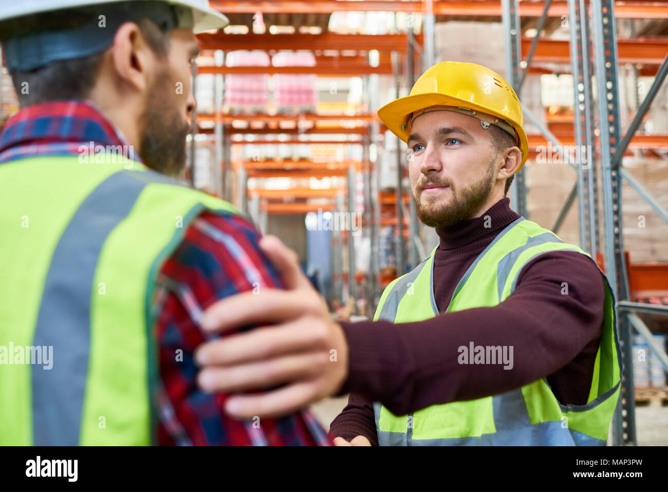 Colleagues in warehouse Stock Photo - Alamy