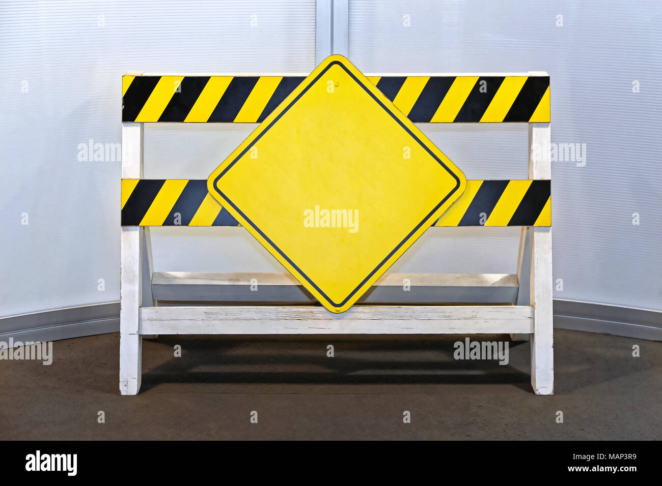 Yellow Sign at Construction Site Barrier Stock Photo - Alamy