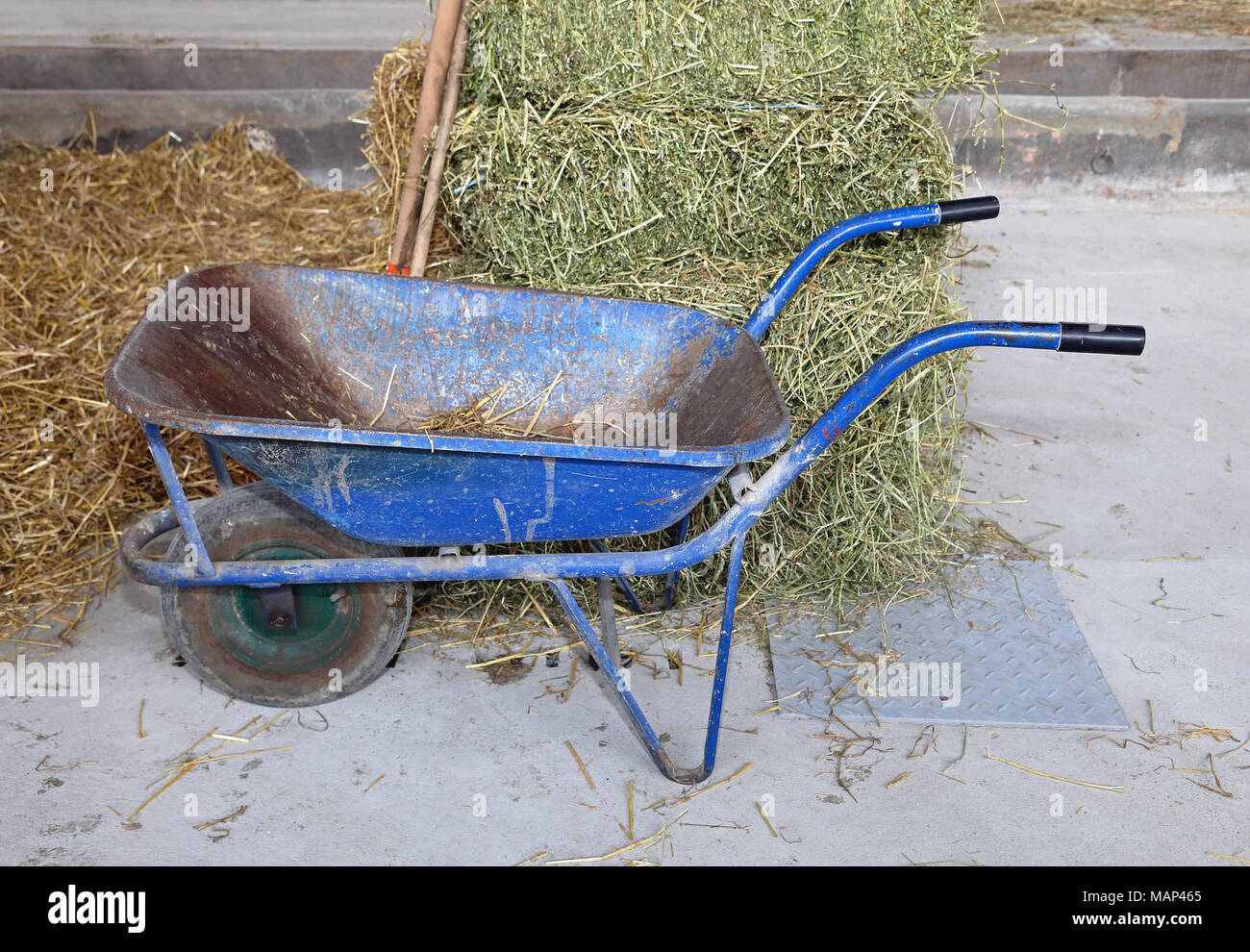 Wheelbarrow Cart in Barn at Farm Stock Photo - Alamy