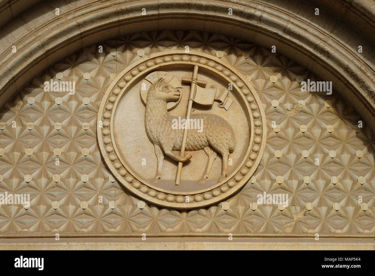 Agnus Dei the Christian symbol of the lamb of God above the main door ...