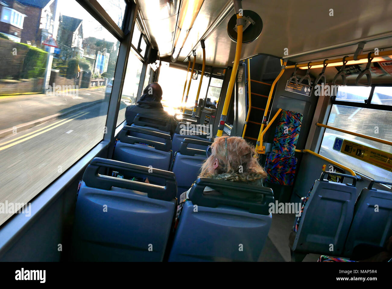 Passengers travelling on bus on on a bright sunny late afternoon Stock ...