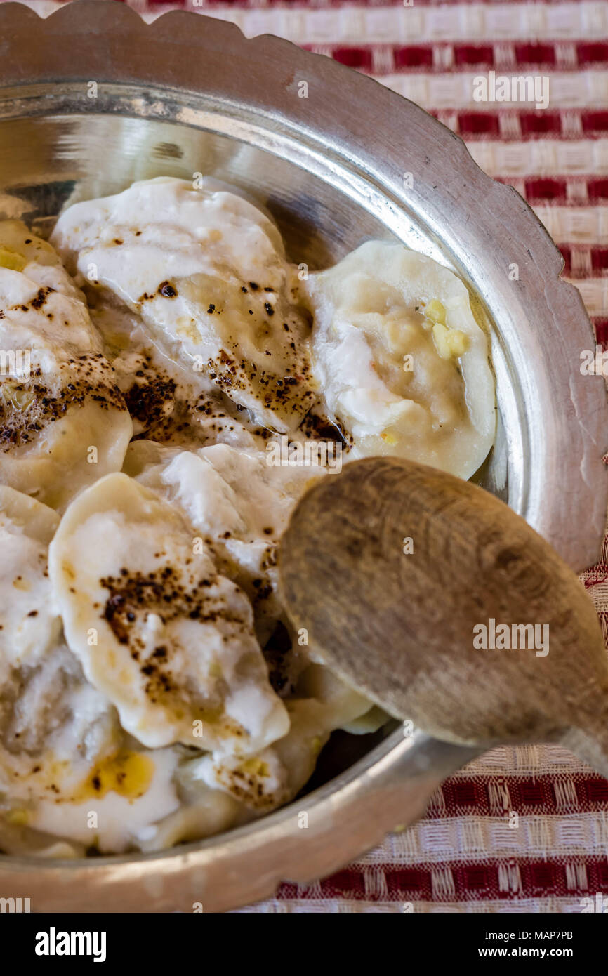 Traditional Circassian ravioli made with potatoes on traditional plate ...