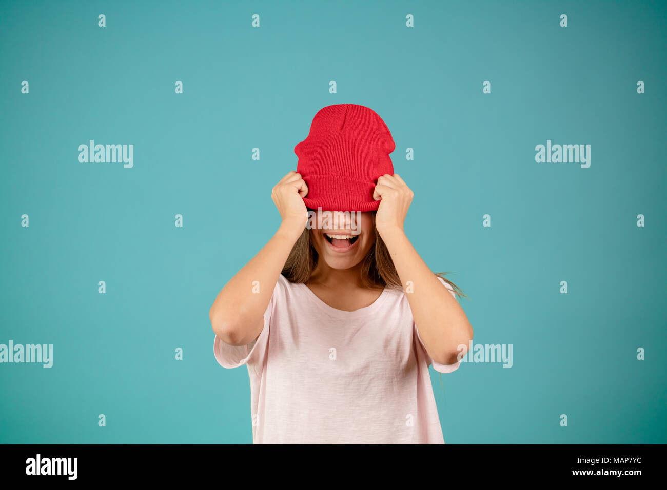 Young woman cap hiding face hi-res stock photography and images - Alamy