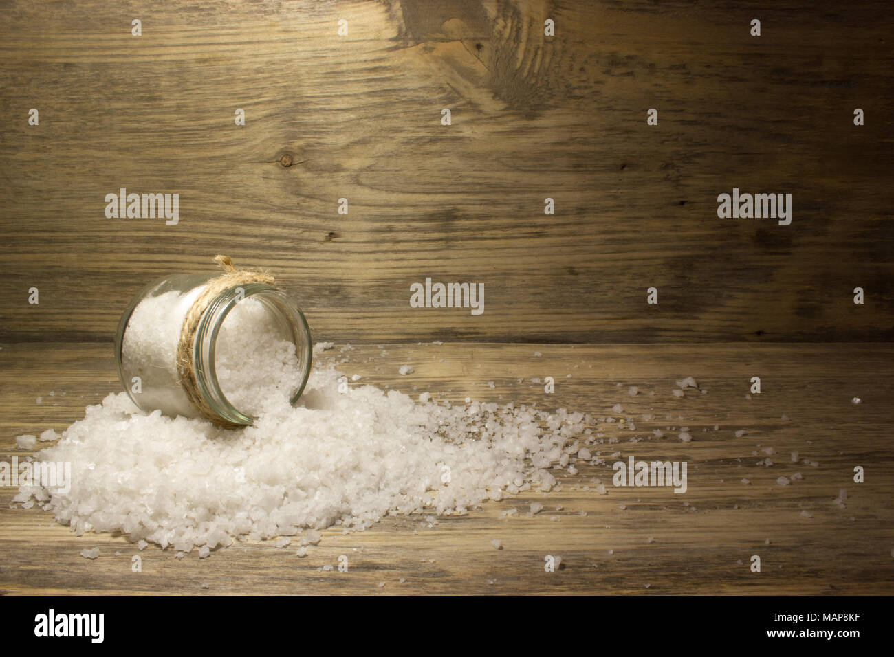 Large sea salt on wooden background Stock Photo - Alamy