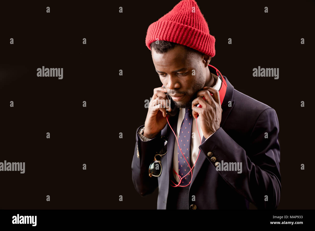 close up cropped image of Afro rapper wearing red cap Stock Photo - Alamy
