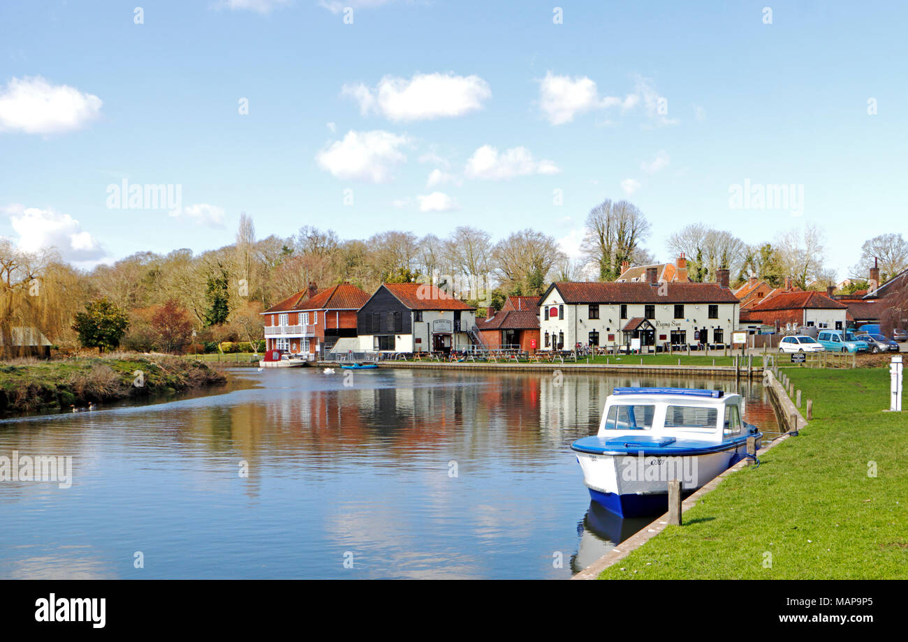 A moored boat by the green on the River Bure on the Norfolk Broads at ...