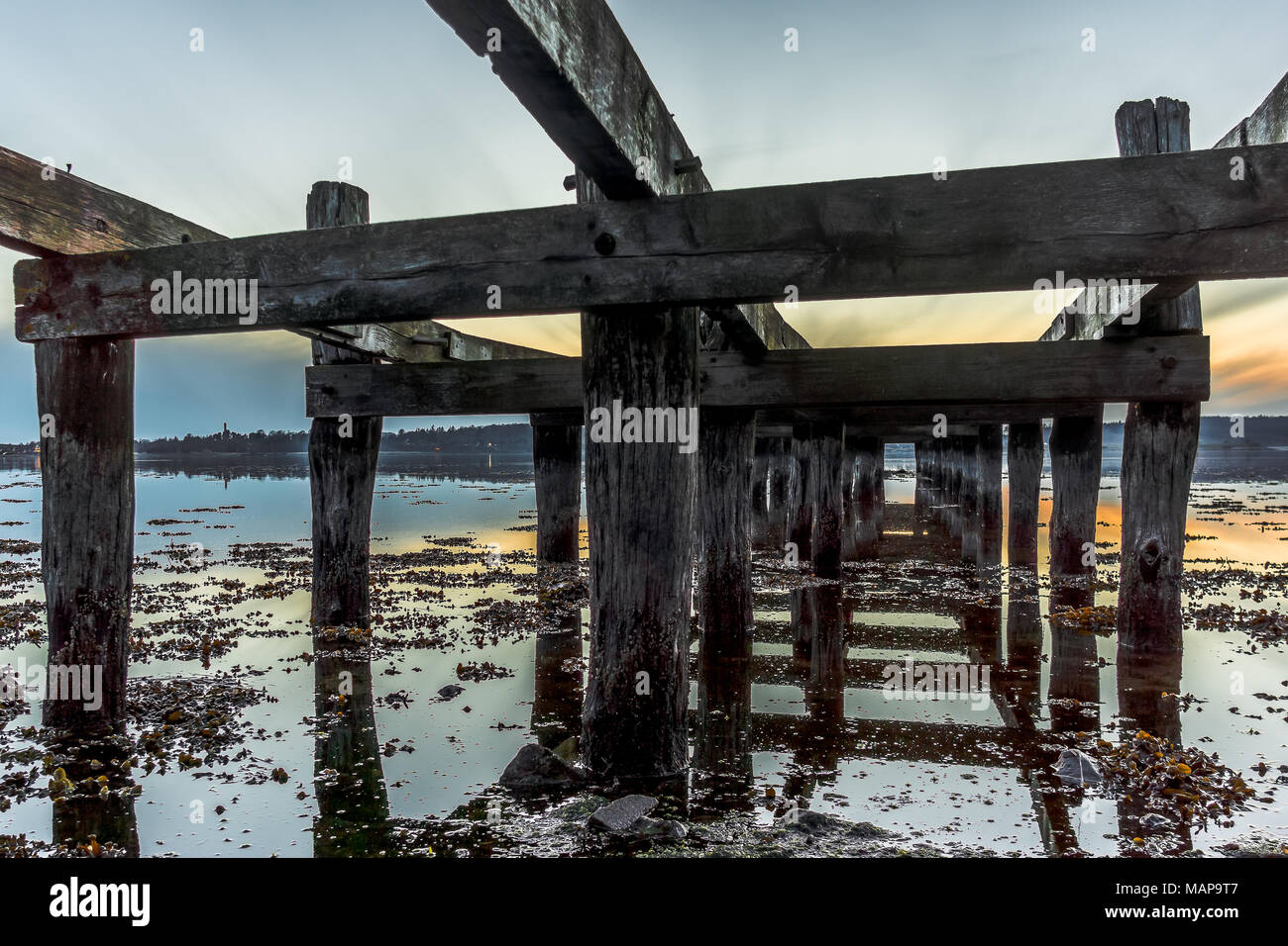 Broken old jetty at sunset hi-res stock photography and images - Alamy