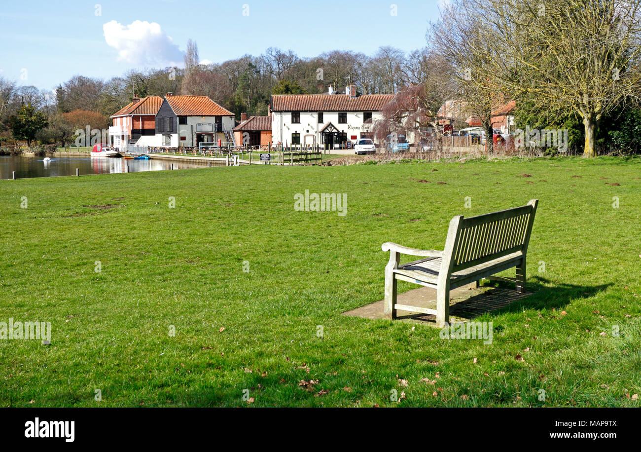 A seat on the green by the River Bure on the Norfolk Broads at ...