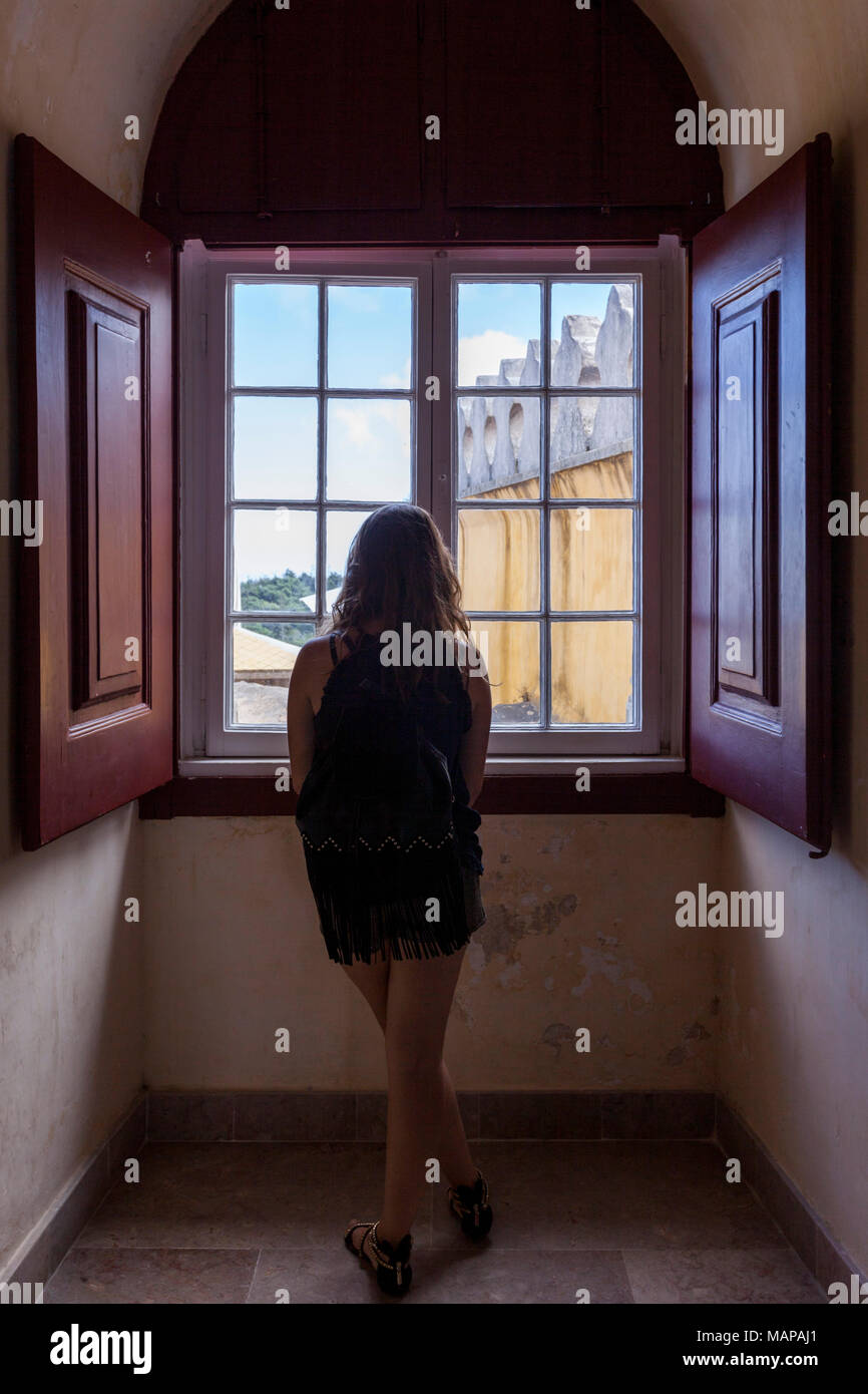 The girl staring out of the window Stock Photo - Alamy
