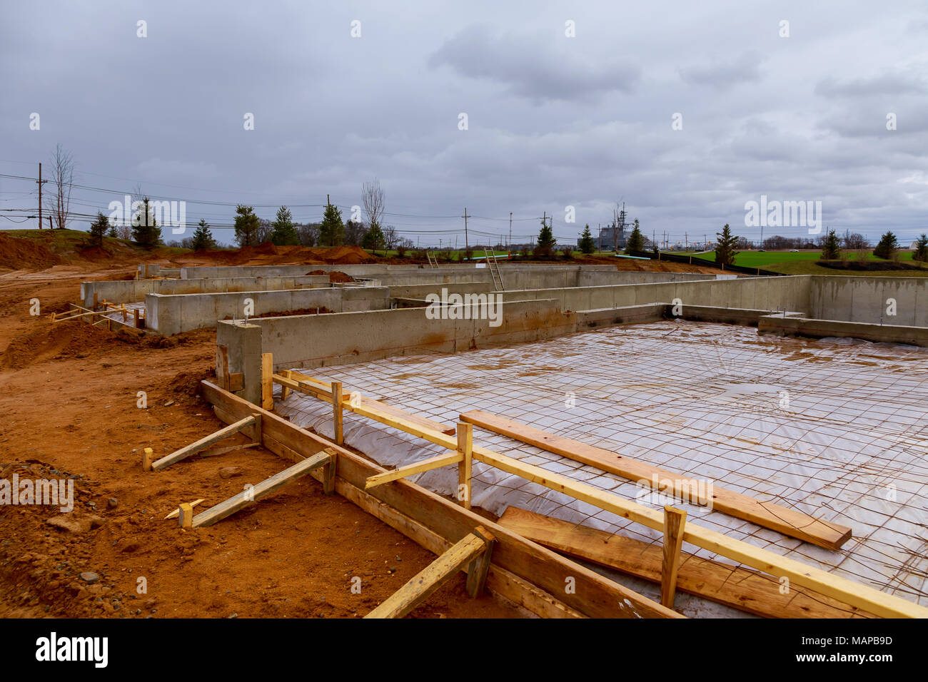 New homes in the process of being built with foundations in the ...