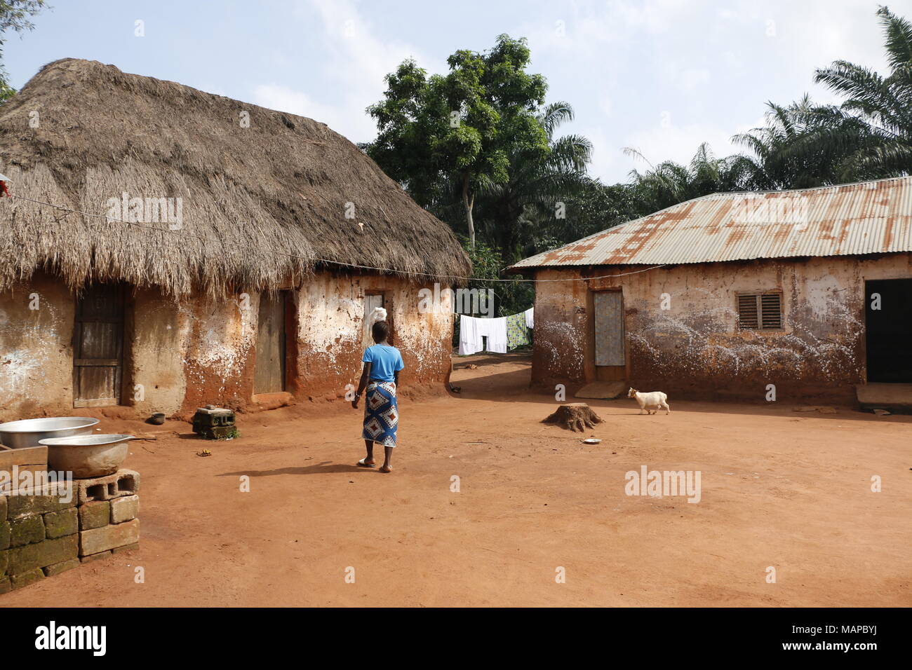 Village life in Benin, woman walks in the village Stock Photo - Alamy