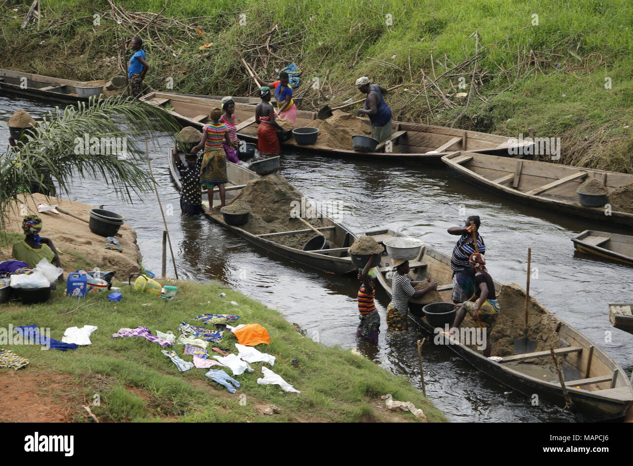 People digging sand in the river for constructions for houses Stock ...
