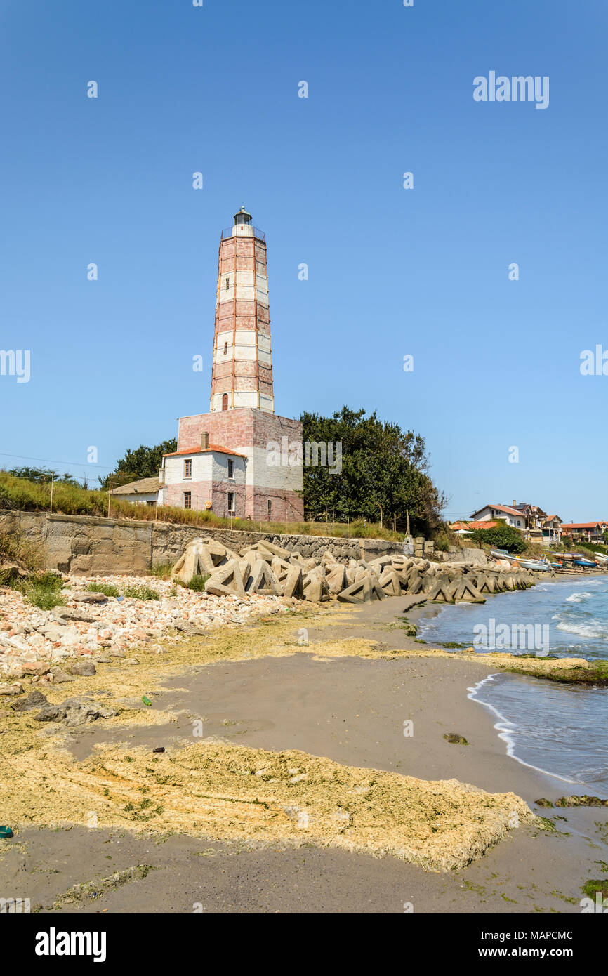 Shabla's Lighthouse from the beach with seaweeds and waves breaker ...