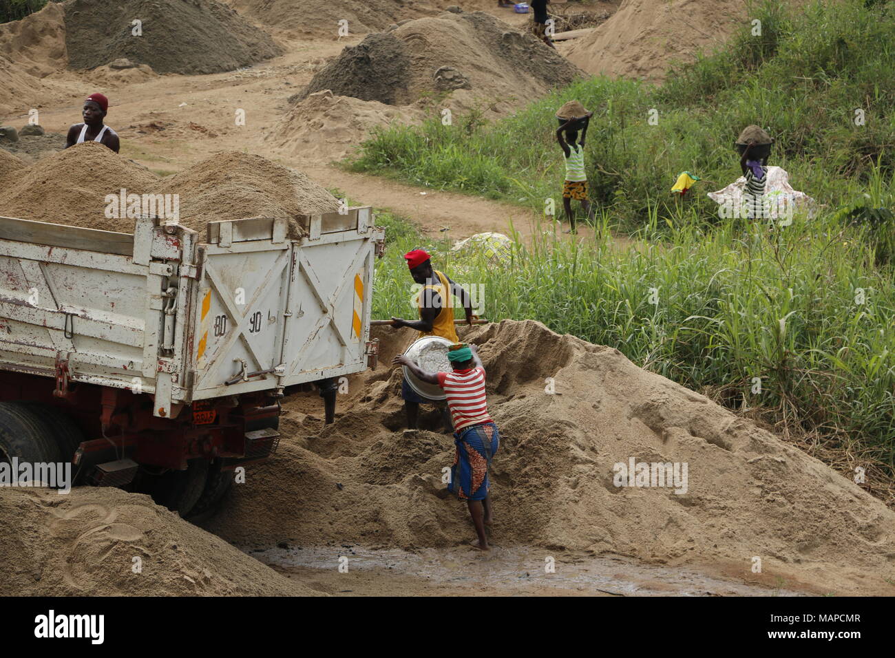 People digging sand in the river for constructions for houses Stock ...