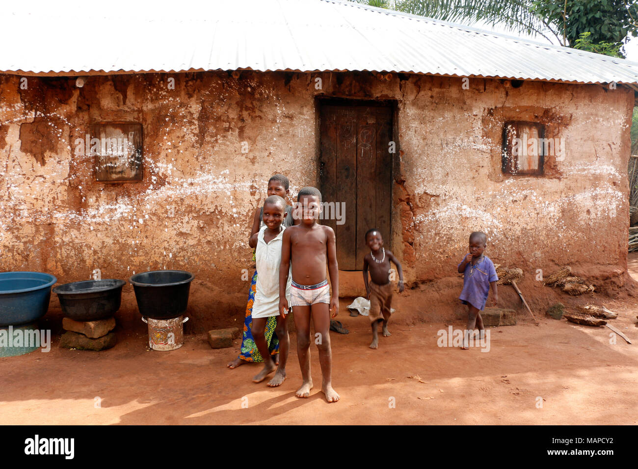 Village life in Benin, children in front of a mud house Stock Photo - Alamy