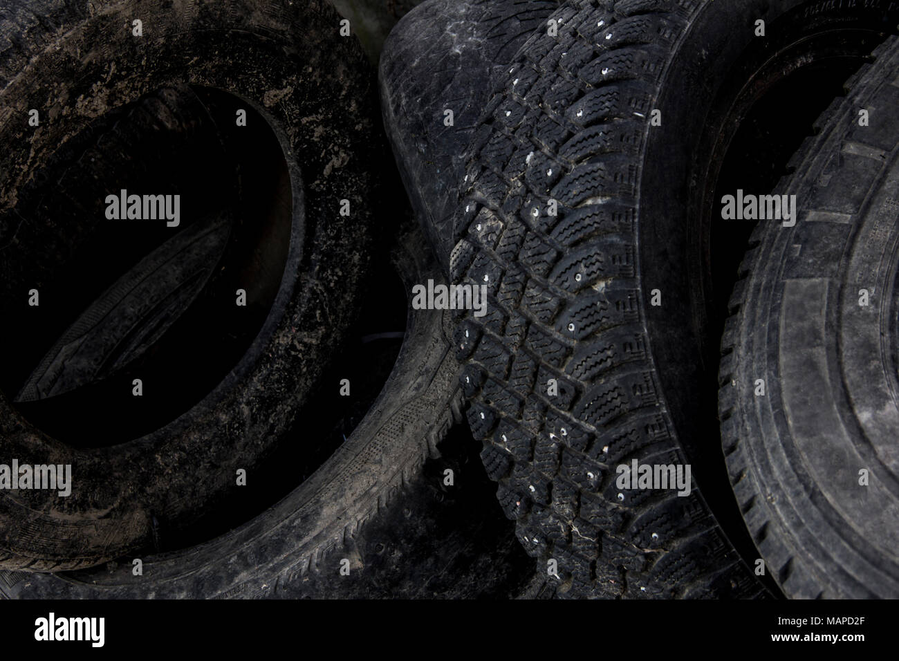 Tyres texture made of part of stack of used tires, close-up, can be ...