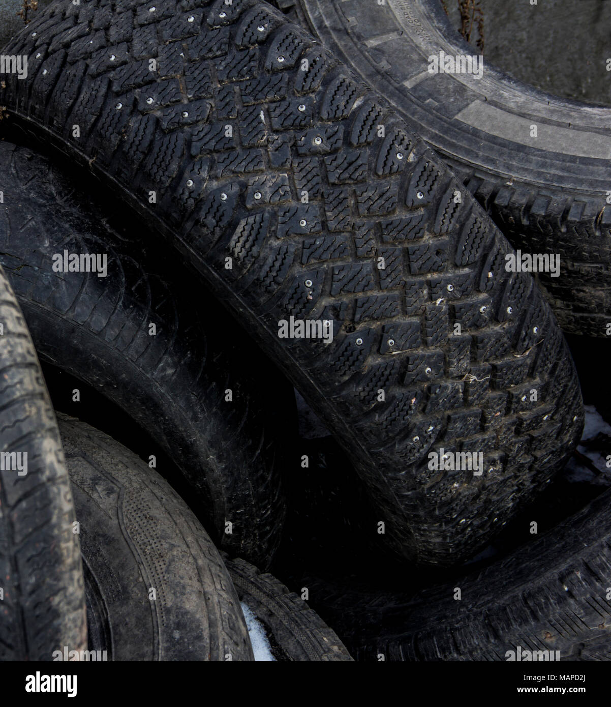 Tyres texture made of part of stack of used tires, close-up, can be ...