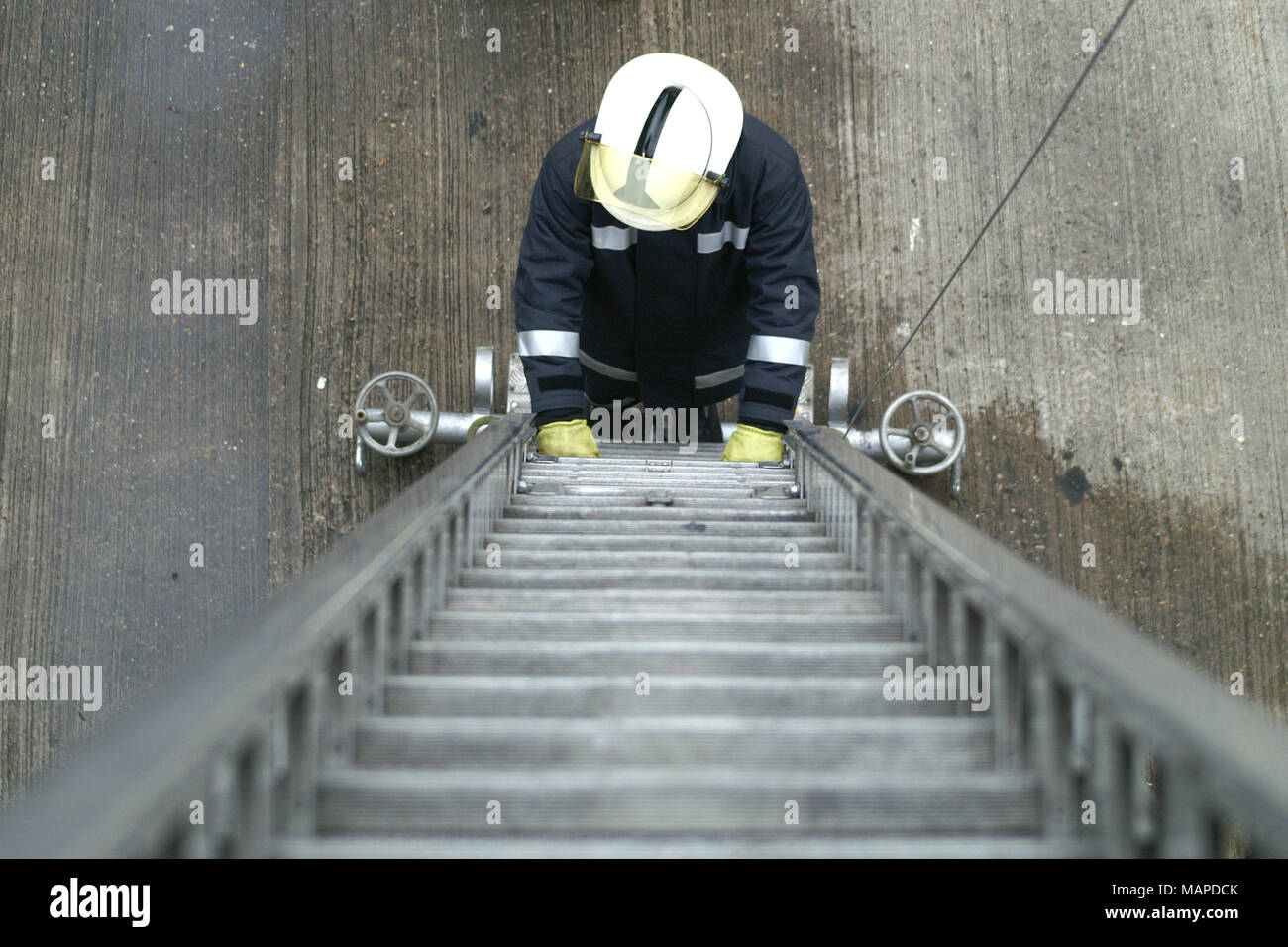 Fireman climbing ladder hi-res stock photography and images - Alamy