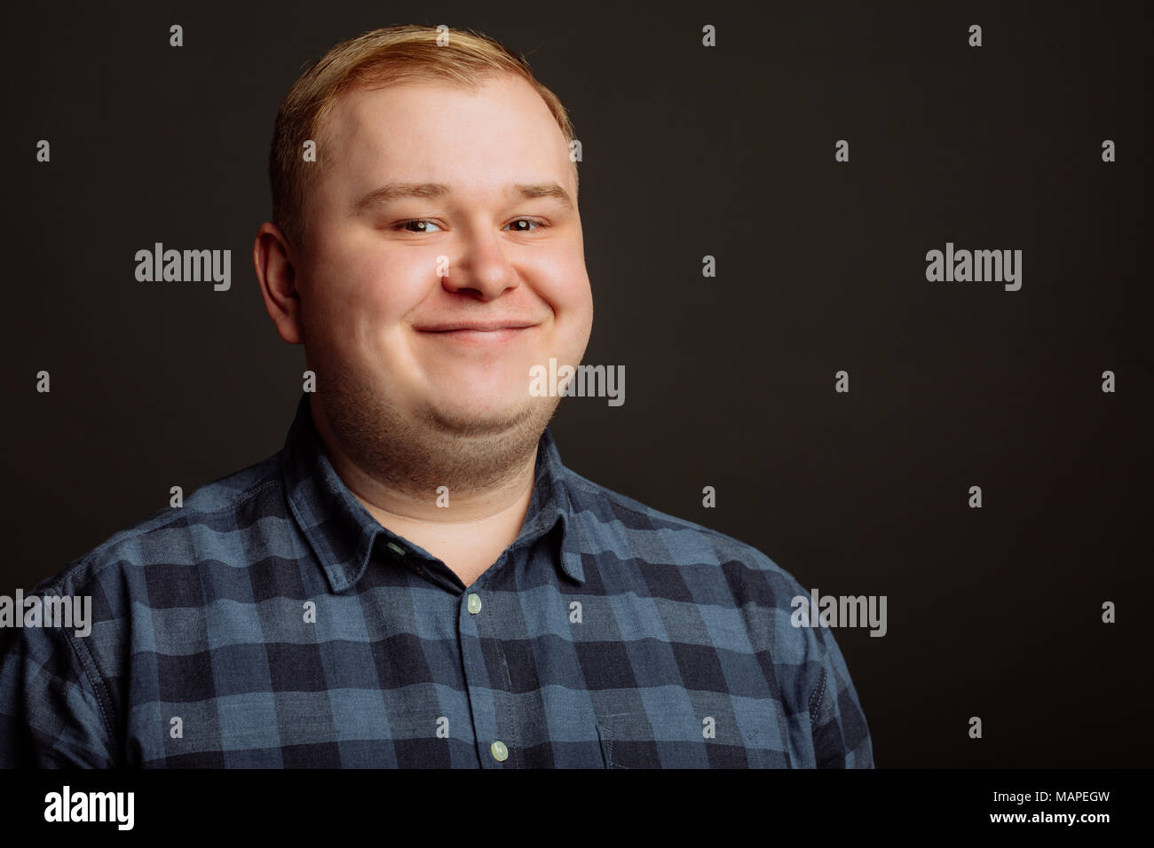 smiling fat man on black background Stock Photo - Alamy