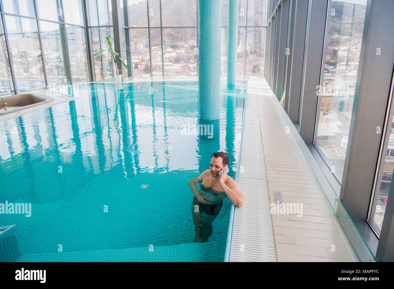 Mobile Phone Swimming Pool High Resolution Stock Photography and Images ...