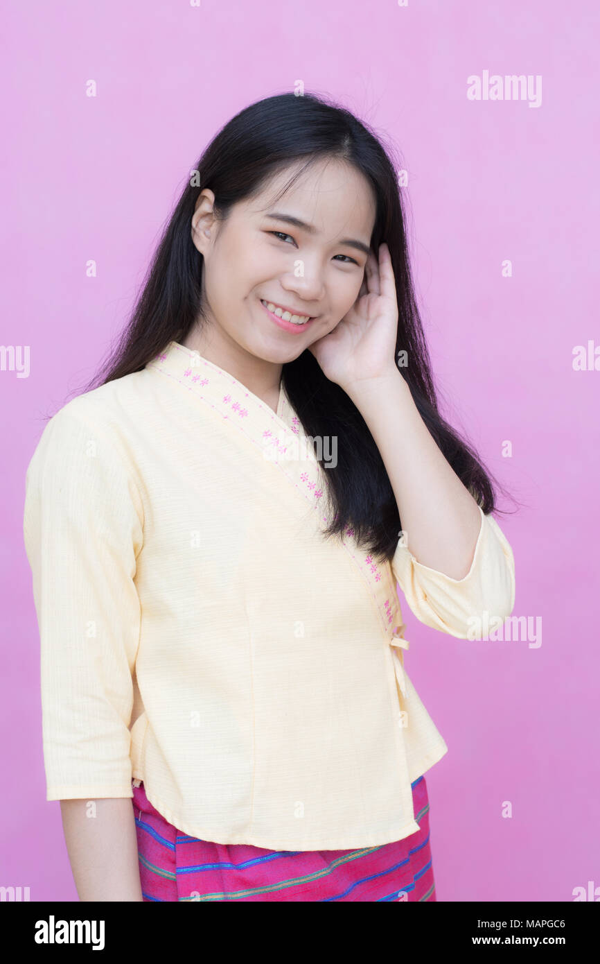 Portrait Beautiful Asian Girl In Traditional Thai Dress Isolated On Pink Background Cotton