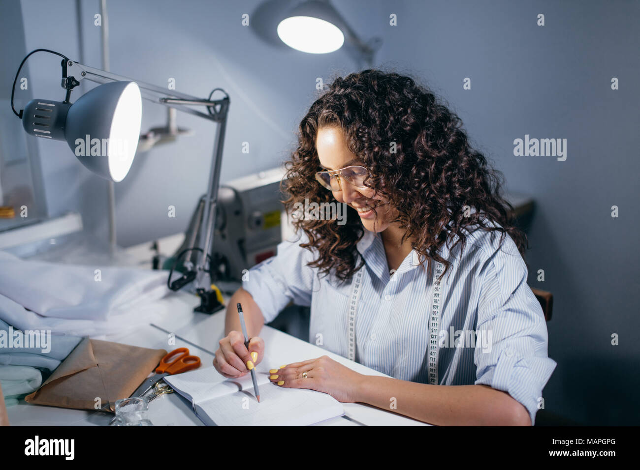 Woman bending over table hi-res stock photography and images - Alamy