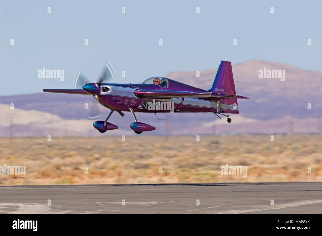 Airplane flying and performing stunts at air show Stock Photo - Alamy