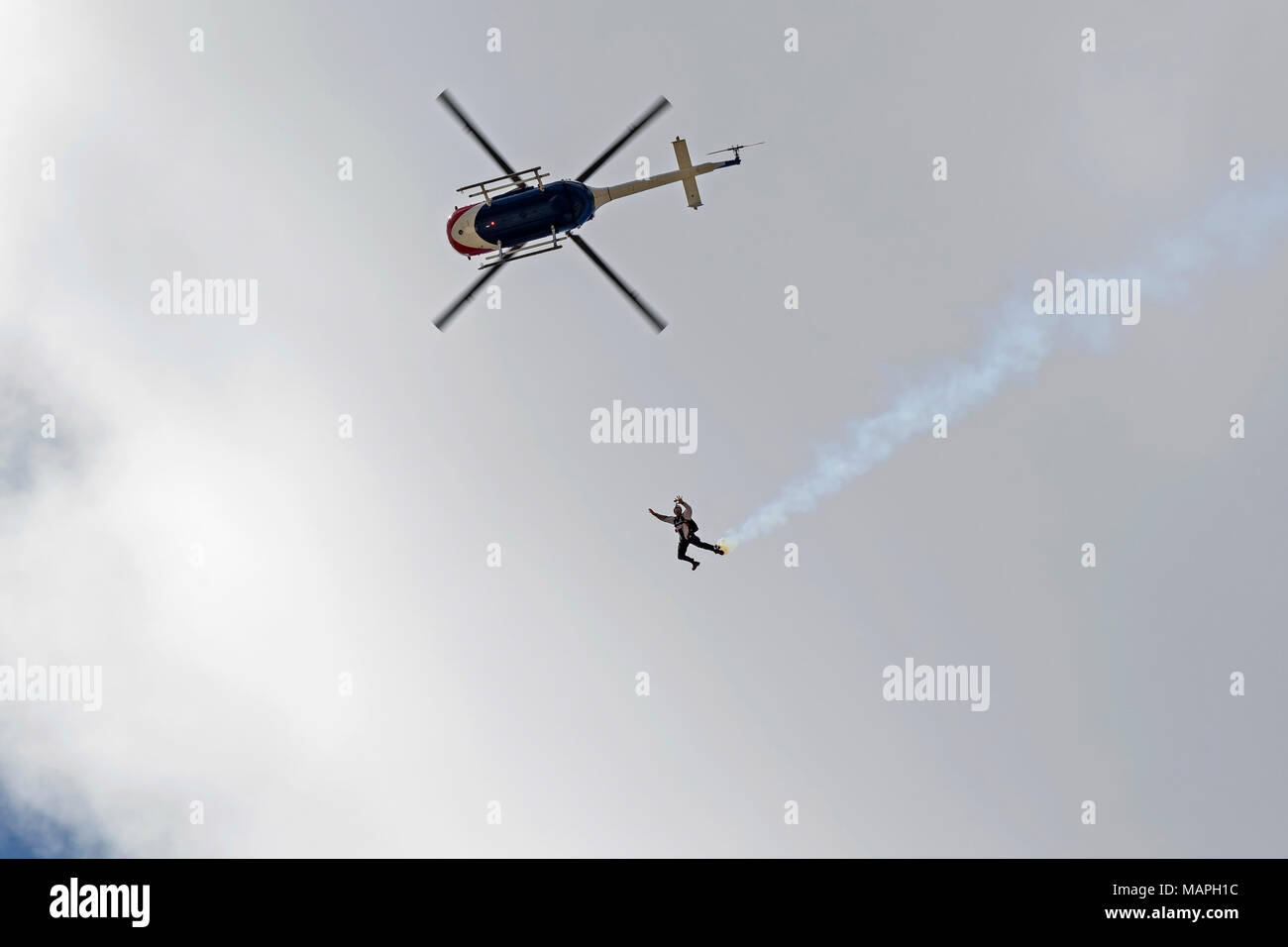 Parachute sky dive from helicopter at airshow Stock Photo - Alamy