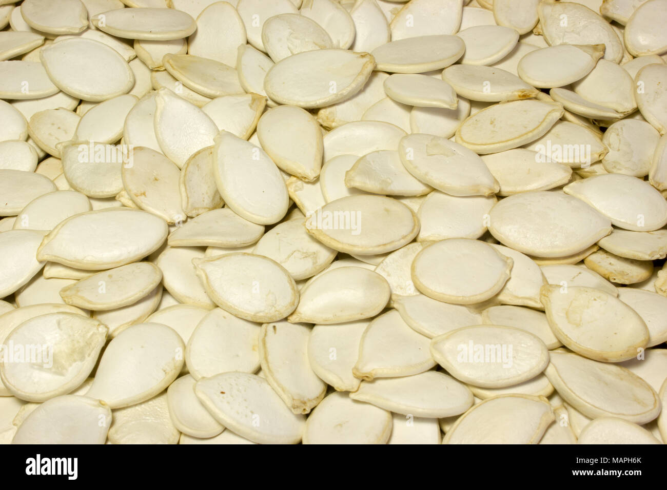 Pumpkin seeds as background Stock Photo - Alamy