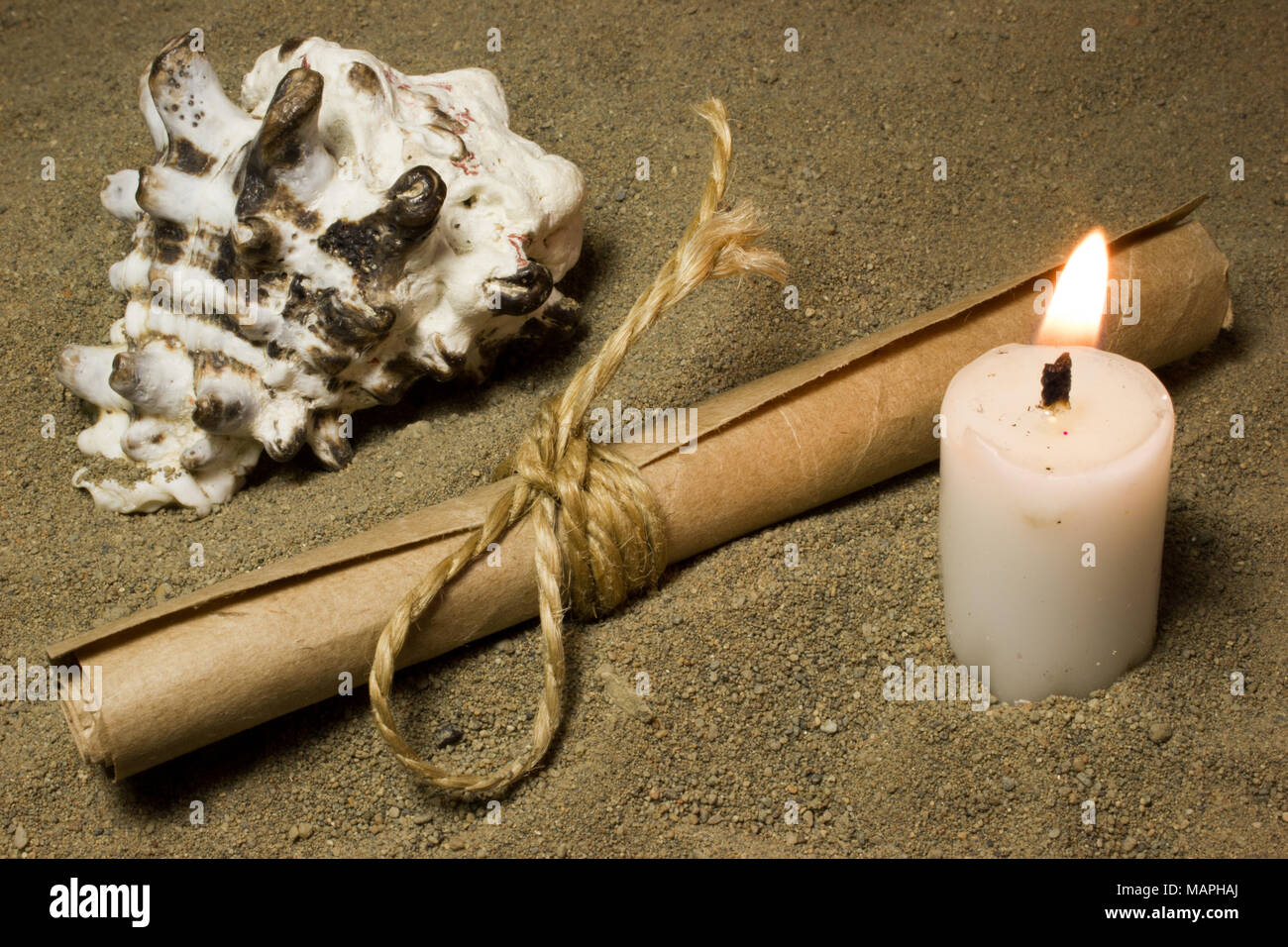 Sea shells, Message Paper scroll on sand Stock Photo - Alamy