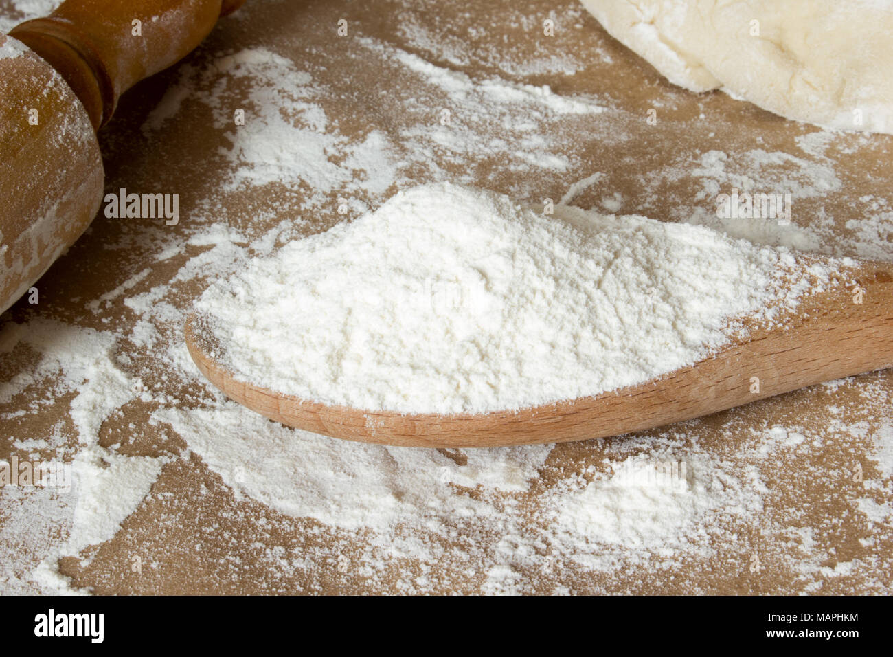 The Bakes table with flour Stock Photo - Alamy