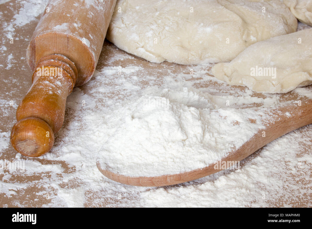 The Bakes table with flour Stock Photo - Alamy