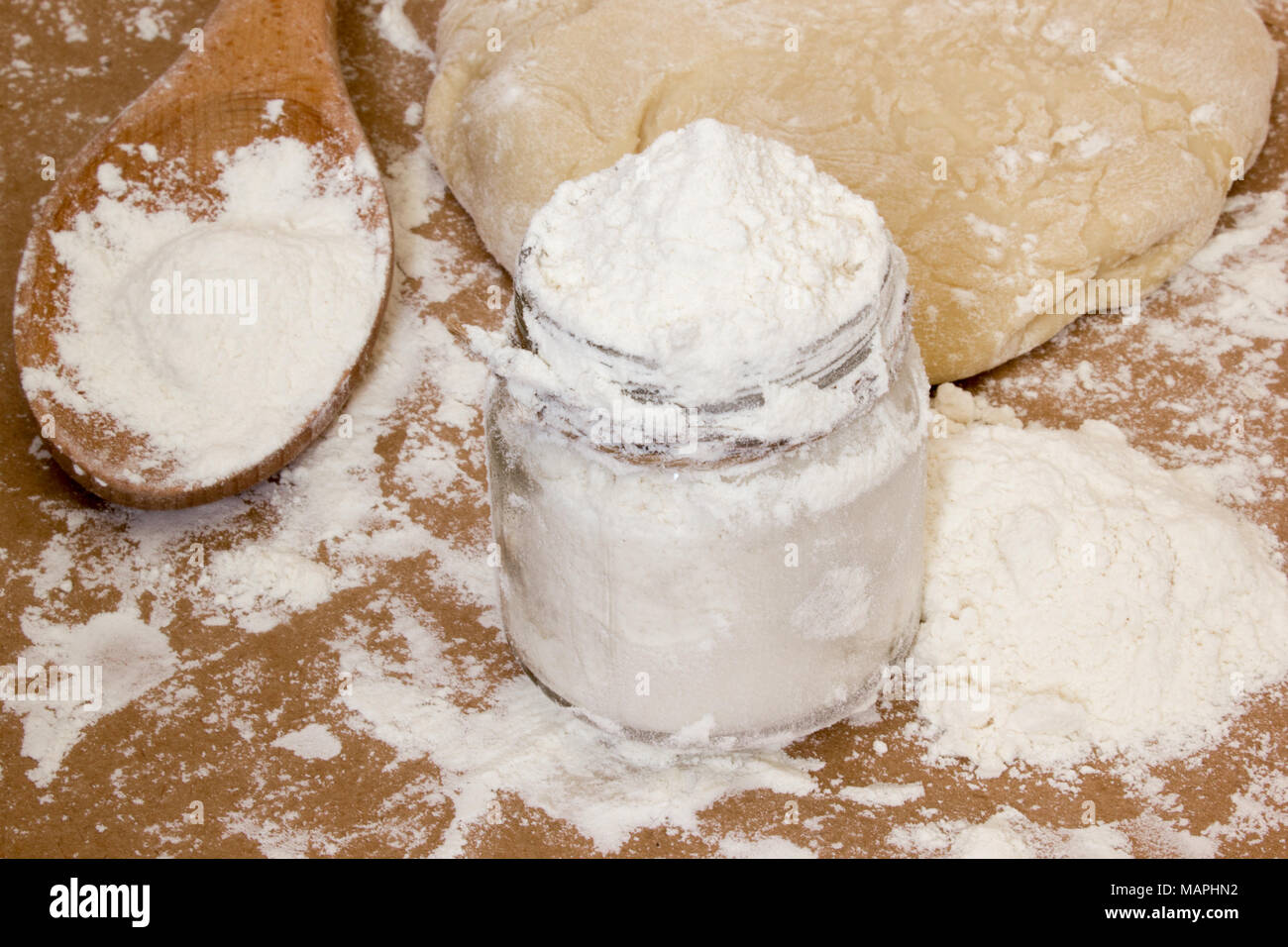 The Bakes table with flour Stock Photo - Alamy