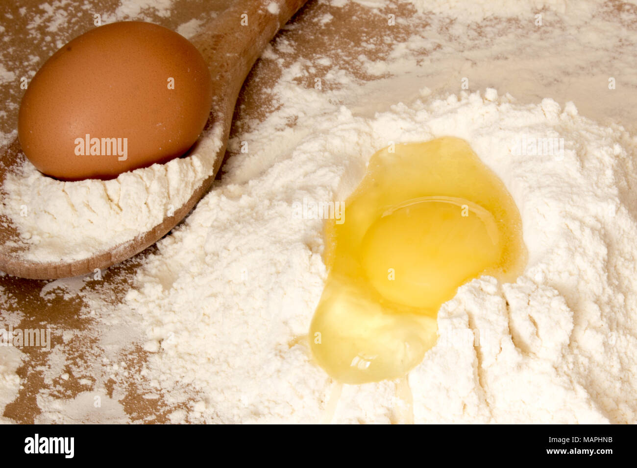 The Bakes table with flour and eggs Stock Photo - Alamy