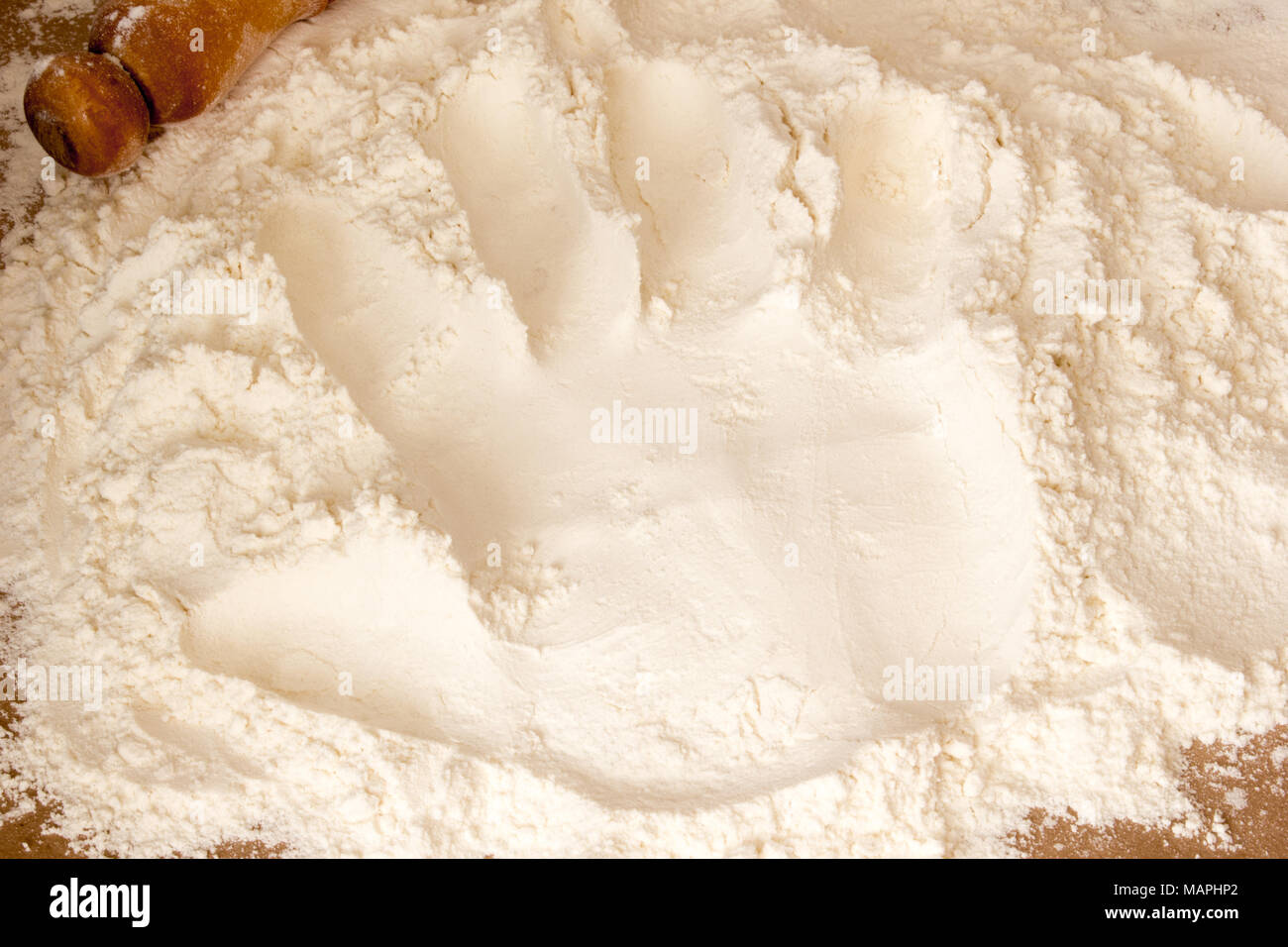The Bakes table with flour Stock Photo - Alamy